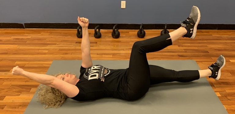 How to Do the Dead Bug Core Exercise Better! - Ultimate Sandbag Training